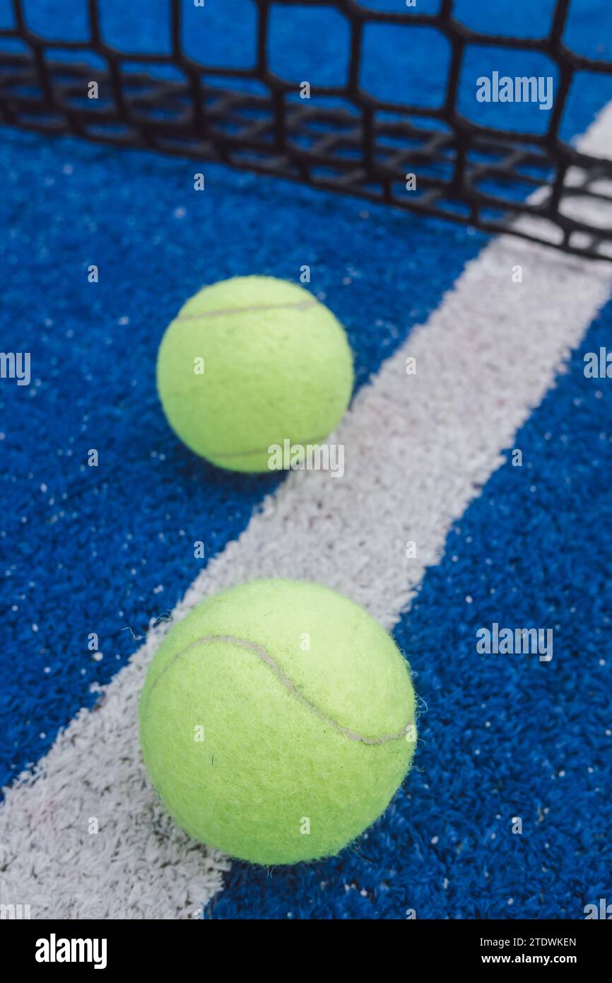 two balls in a blue paddle tennis court, racket sports courts Stock ...