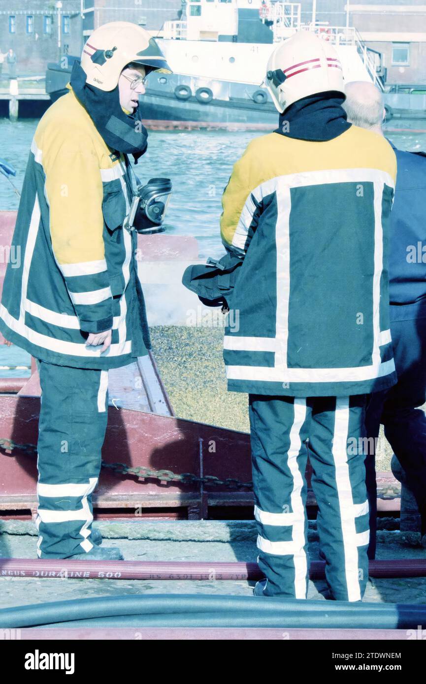 Fire brigade at bean brewing in a ship, IJmuiden, The Netherlands, 14 ...