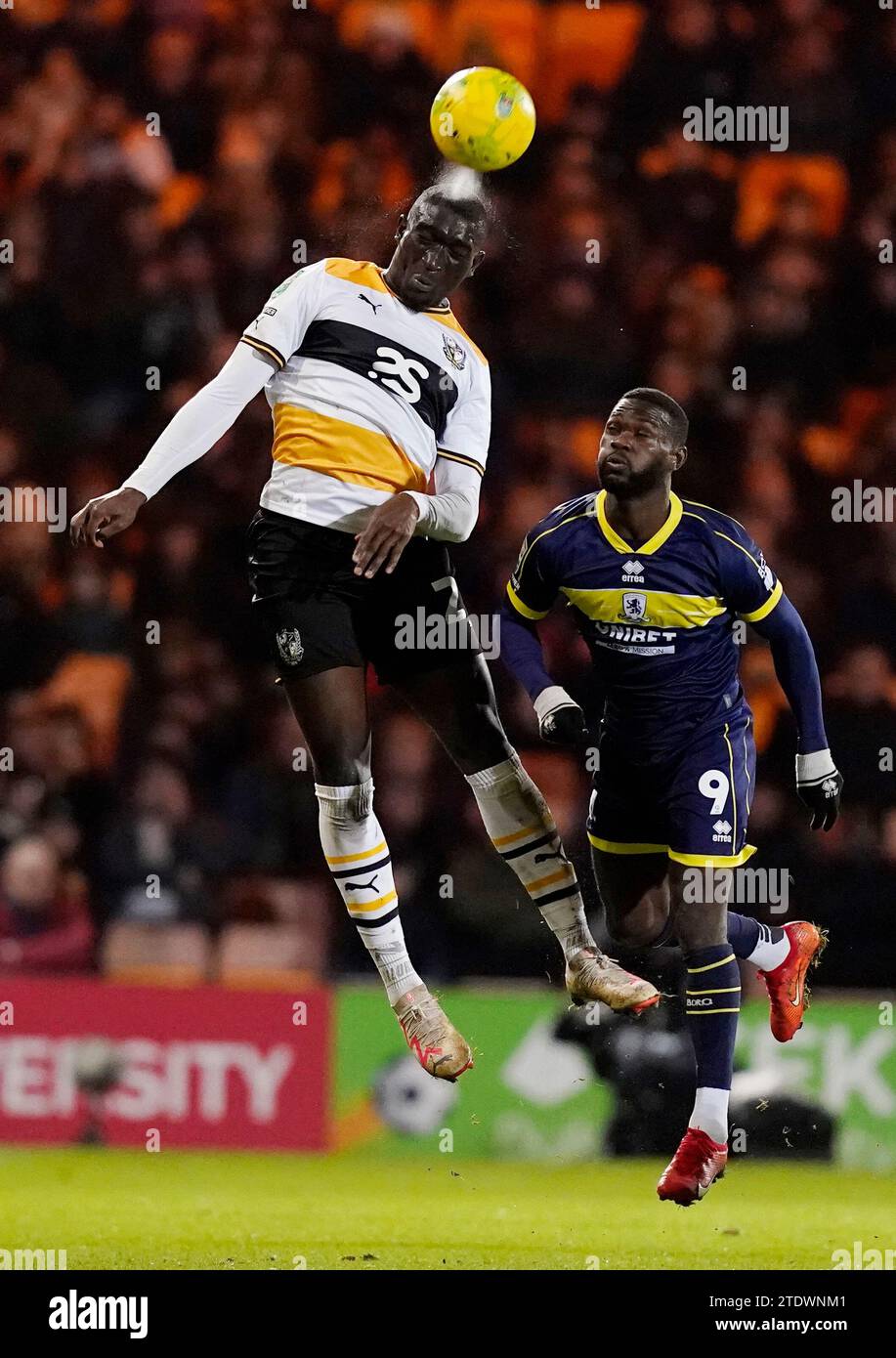 Burslem, UK. 19th Dec, 2023. Jesse Debrah of Port Vale (L) wins a ...