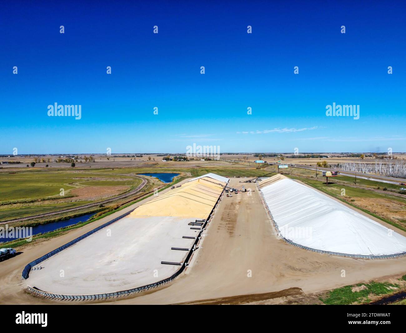 Drone view over grain storage piles being filled and covered Stock ...