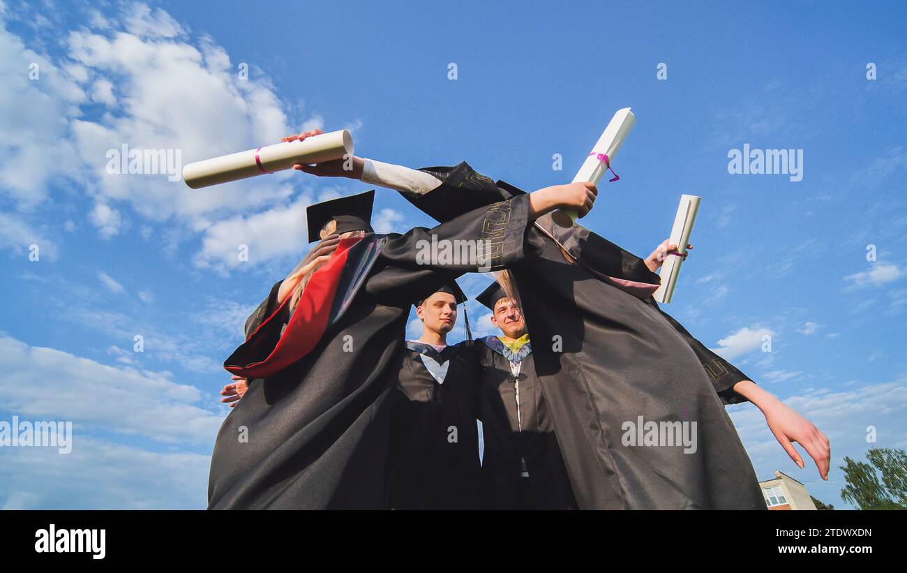 College graduates embrace in a circle Stock Photo - Alamy