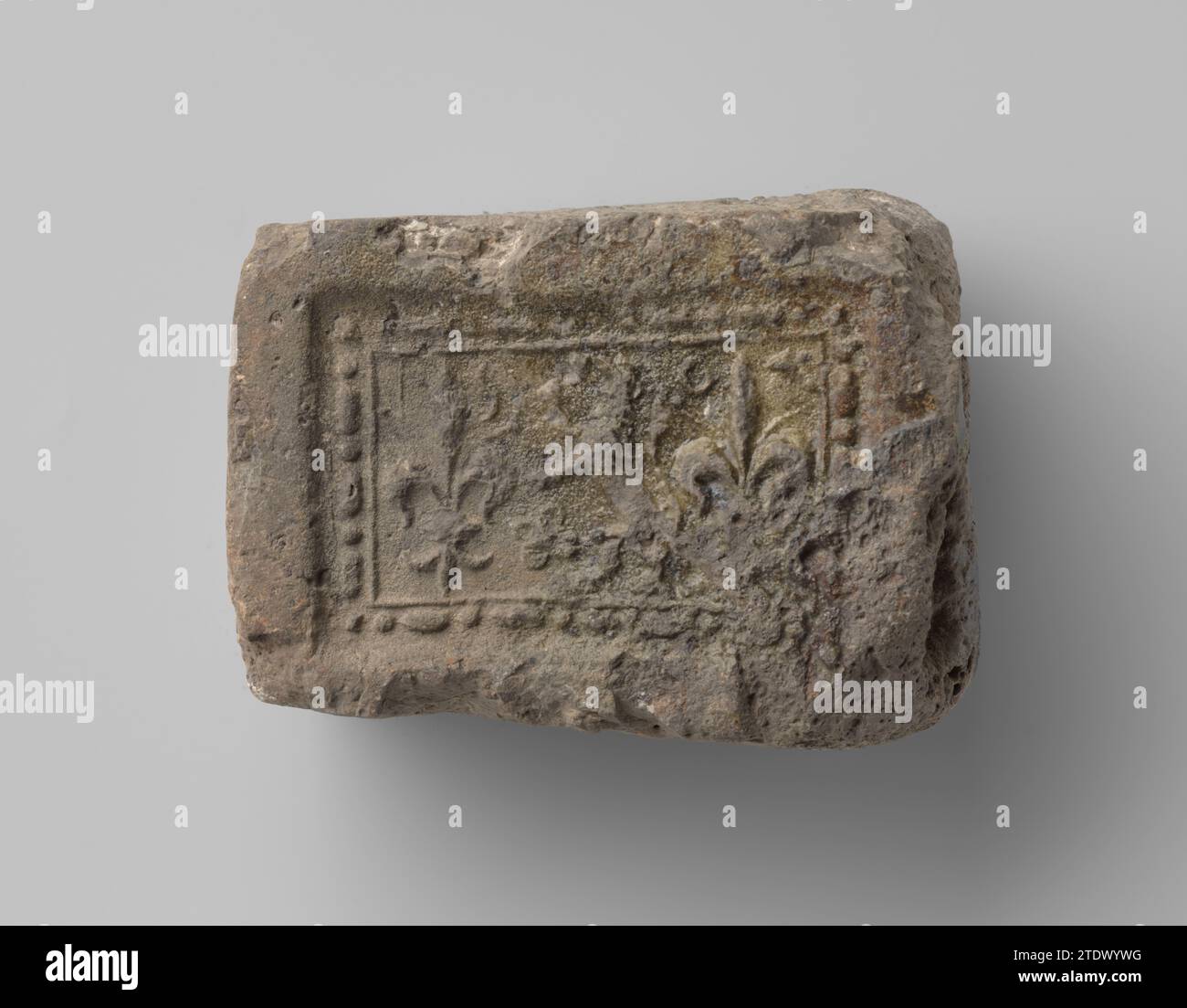 Hearing stone with the presentation of a climbing lion flanked by two ...