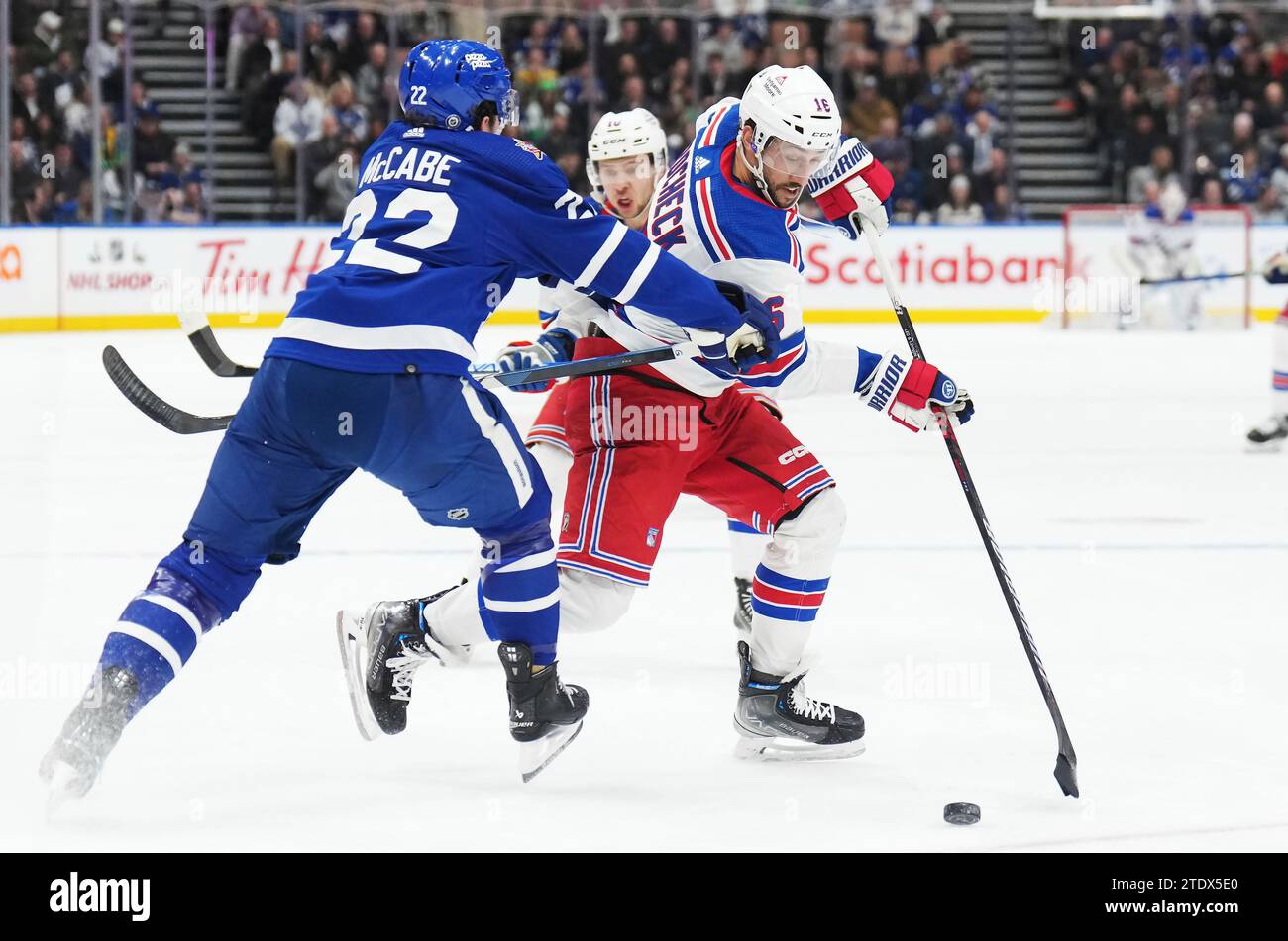 Toronto Maple Leafs defenseman Jake McCabe (22) checks New York Rangers ...