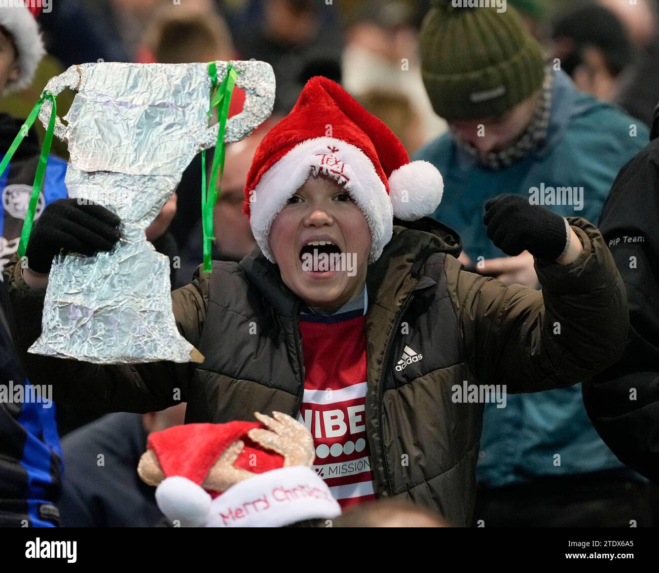 A young Boro fan holds a home made trophy during the Carabao Cup ...
