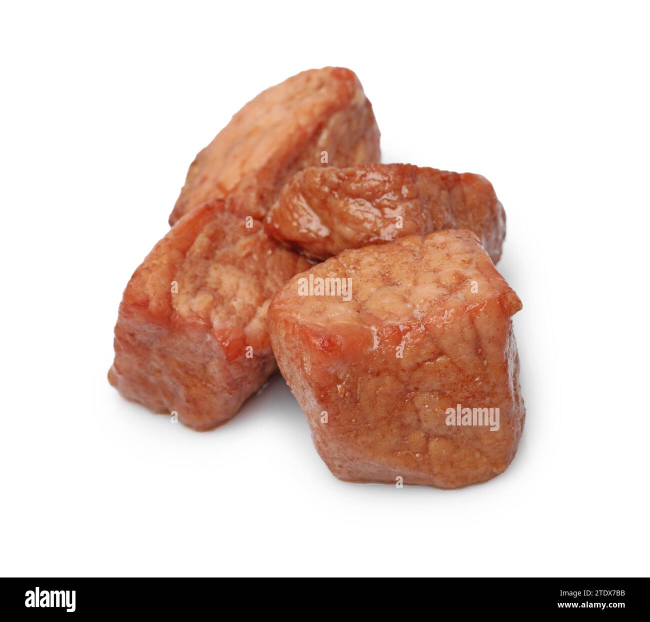 Pieces of delicious cooked beef isolated on white. Tasty goulash Stock ...