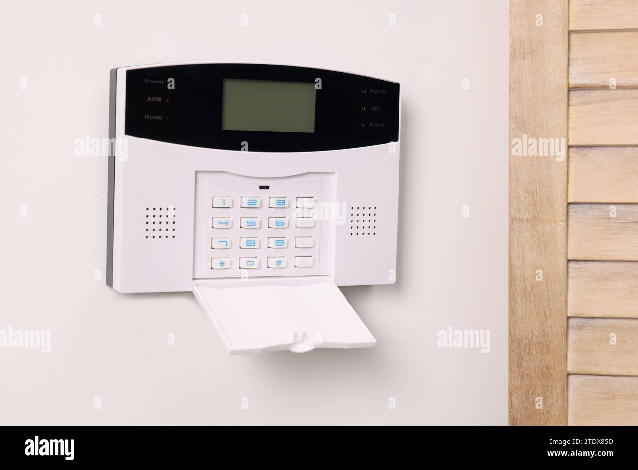 Home security alarm system on white wall indoors Stock Photo - Alamy