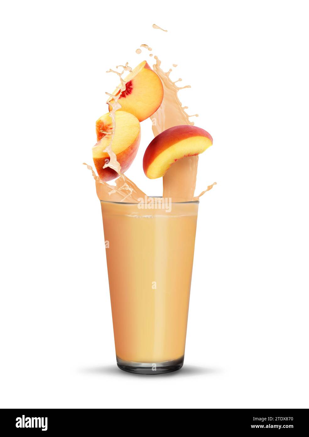 Fresh peach juice splashing from glass on white background Stock Photo ...