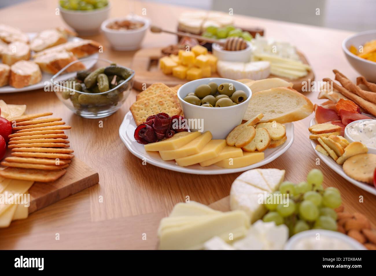Assorted appetizers served on wooden table, closeup Stock Photo - Alamy