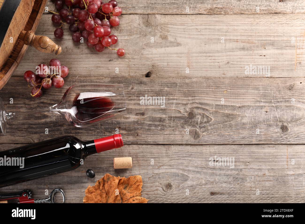 Winemaking. Flat lay composition with tasty wine and barrel on wooden ...