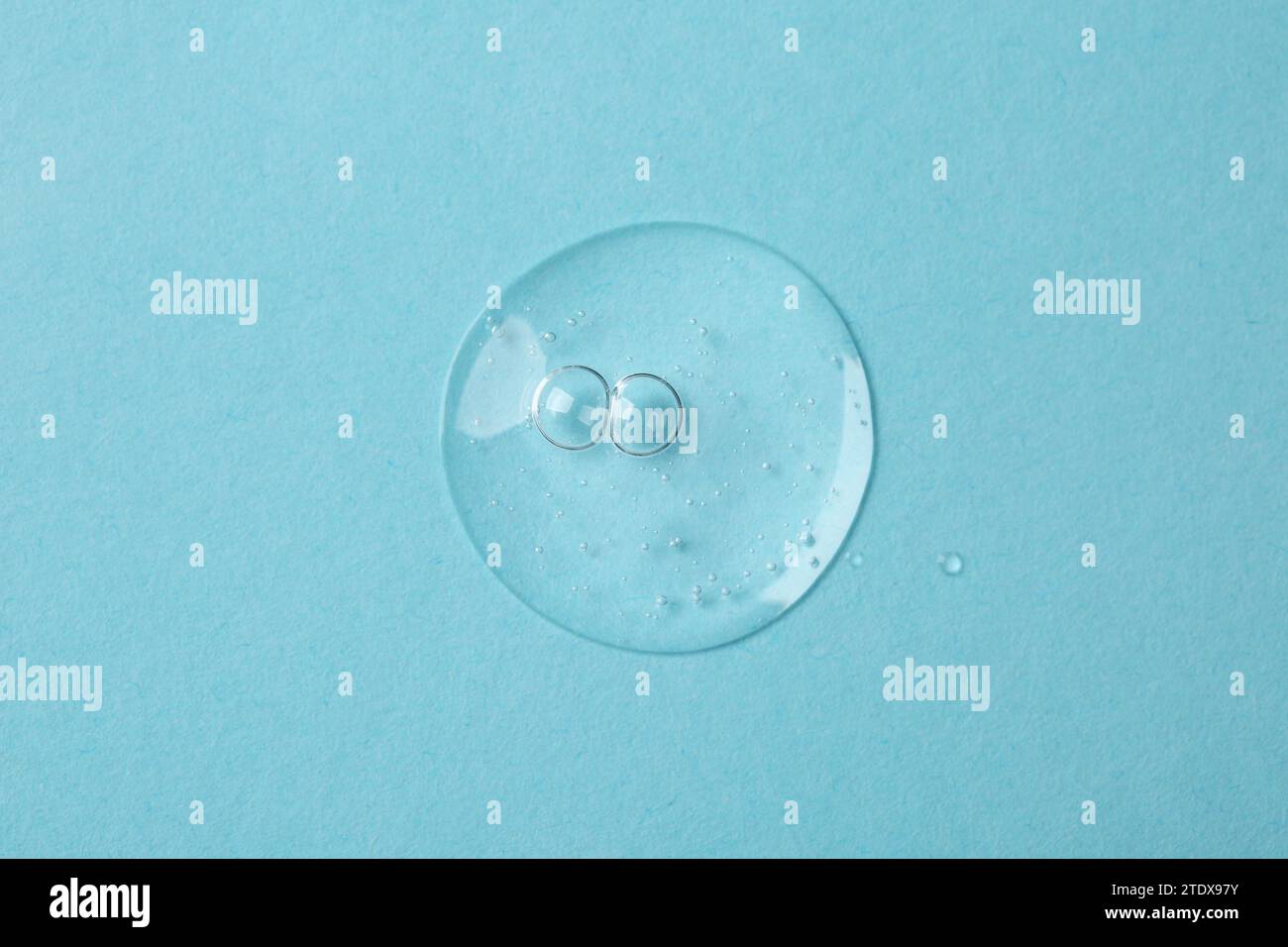 Sample of cosmetic serum on light blue background, top view Stock Photo ...