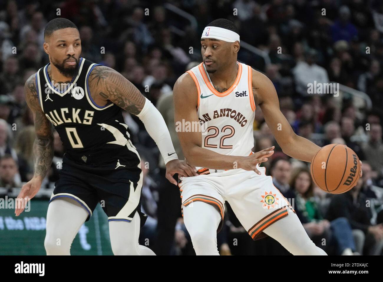 San Antonio Spurs' Malaki Branham tries to get past Milwaukee Bucks ...