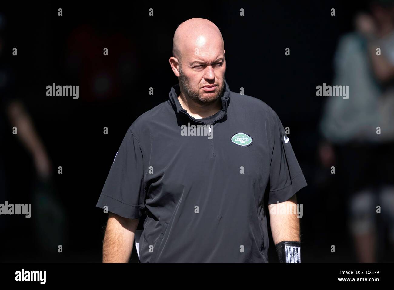 New York Jets defensive line coach Aaron Whitecotton walks onto the ...