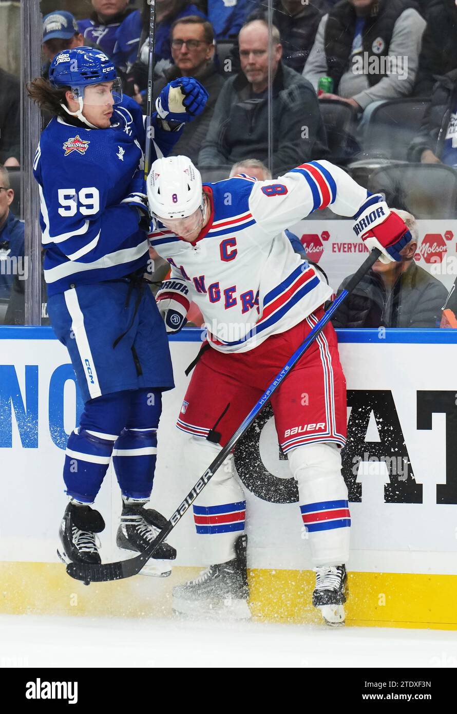 Toronto Maple Leafs forward Tyler Bertuzzi (59) collides with New York ...