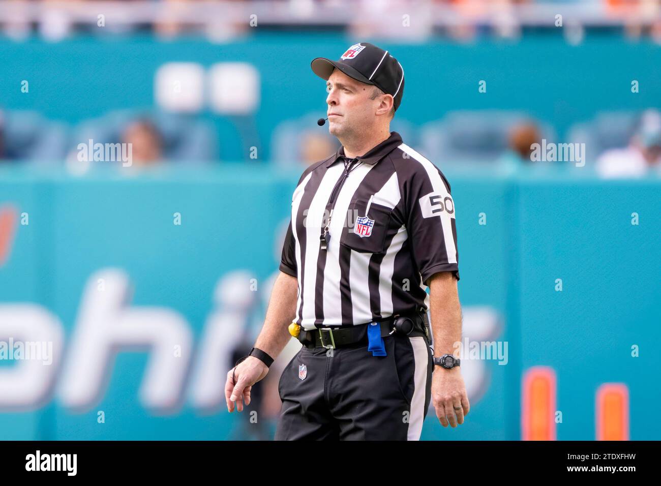 NFL field judge Aaron Santi stands on the field during an NFL football ...