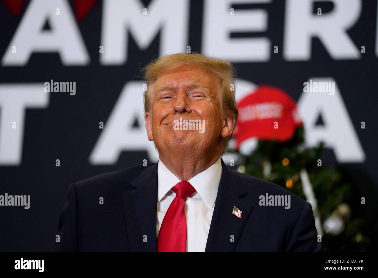 Former President Donald Trump reacts to supporters during a commit to ...