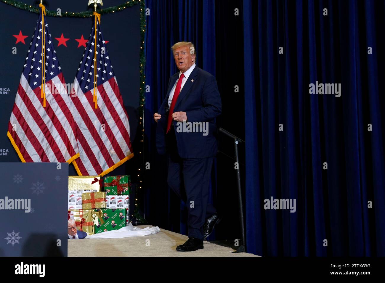 Former President Donald Trump arrives at a commit to caucus rally ...