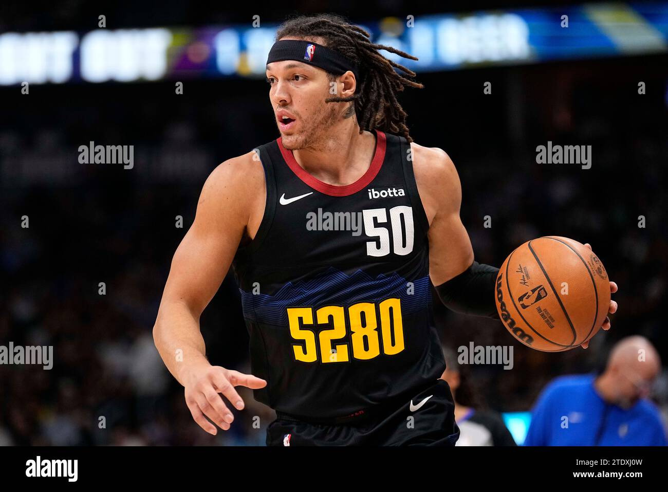 Denver Nuggets forward Aaron Gordon brings the ball up court against ...