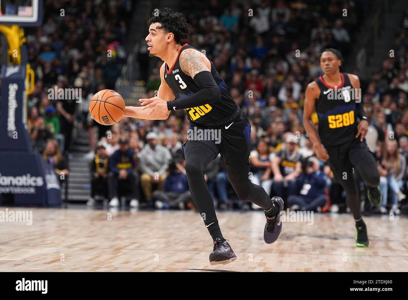Denver Nuggets guard Julian Strawther brings the ball up court against ...