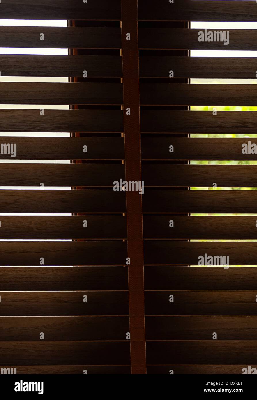 Window through wooden shutters blinds Stock Photo - Alamy