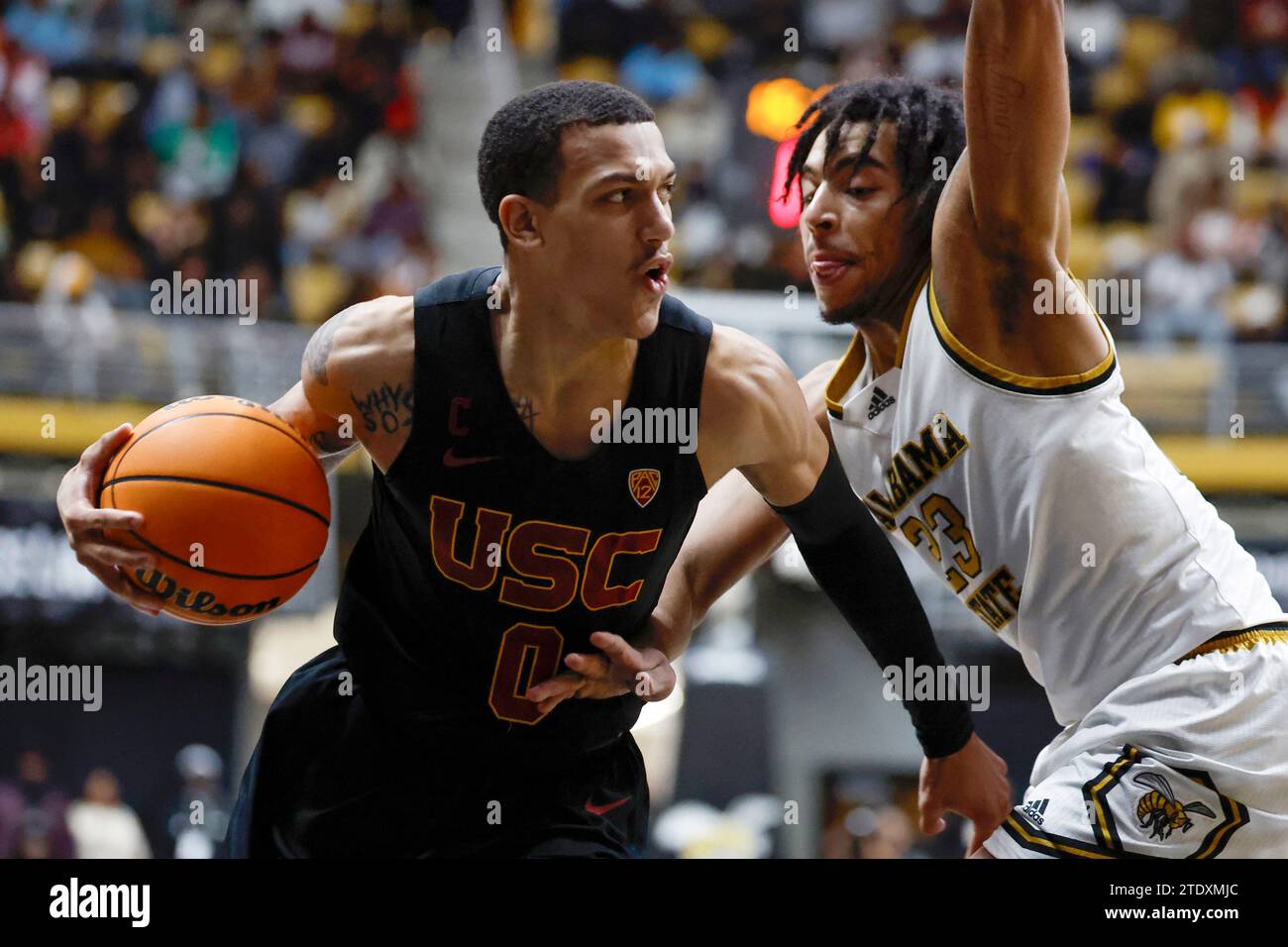 Southern California guard Kobe Johnson (0) dribbles around Alabama ...