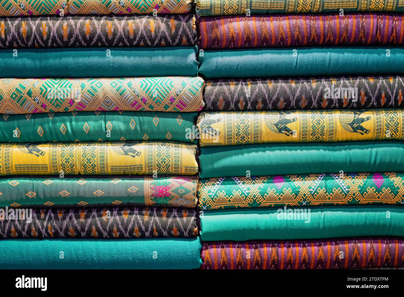 Colorful fabrics, bedspreads and kerchiefs with different oriental ...