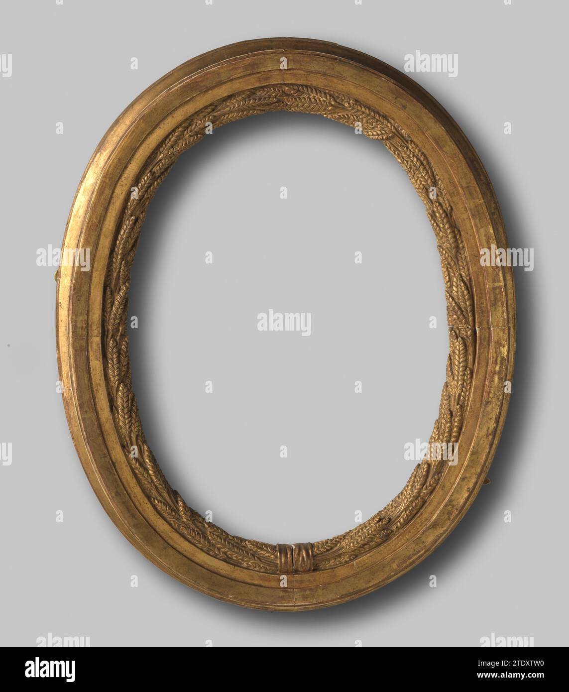 Oval gilt frame with cut ornaments on the day side, associated with the ...