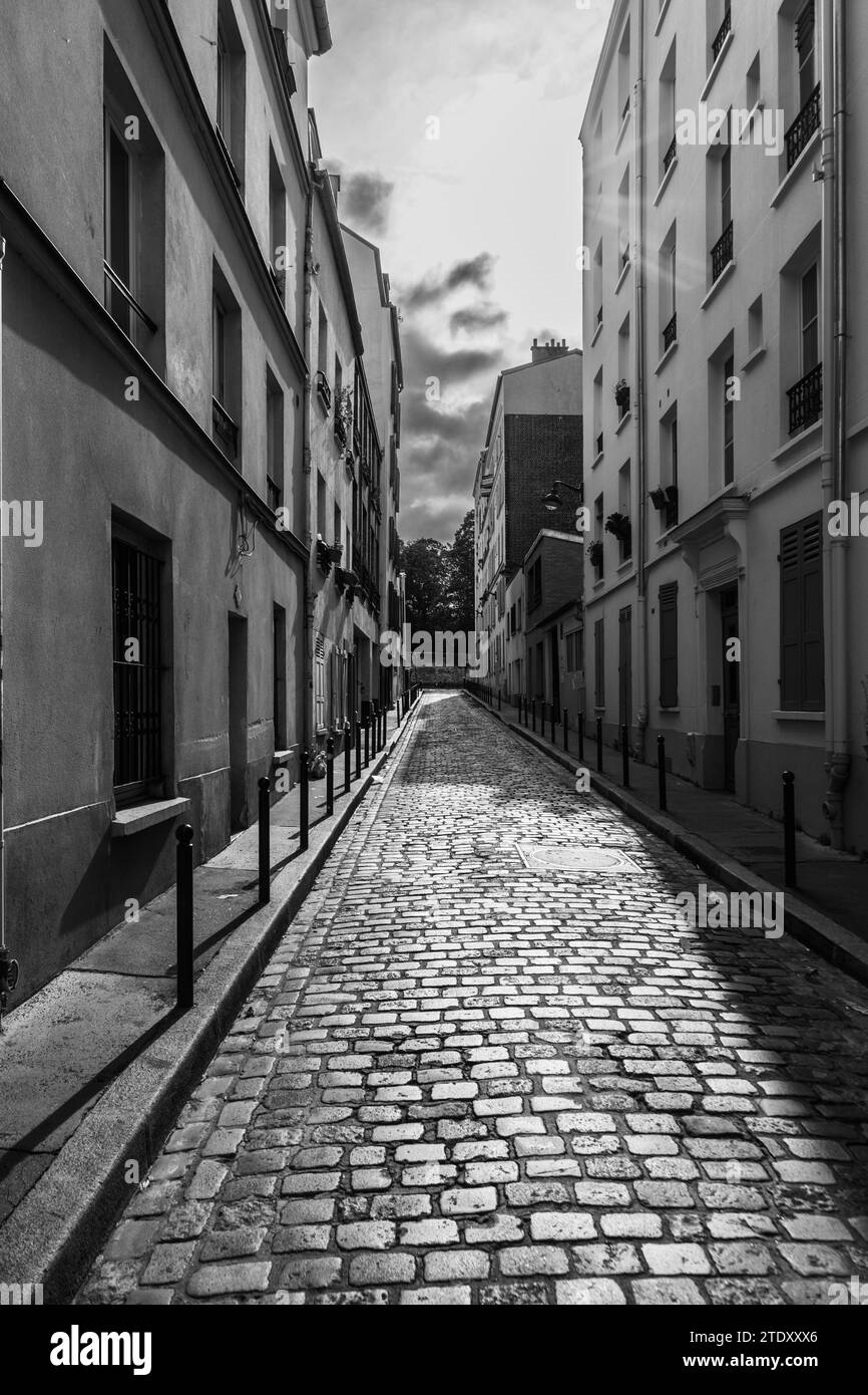 Narrow cobblestone street in Black and White Stock Photos & Images - Alamy