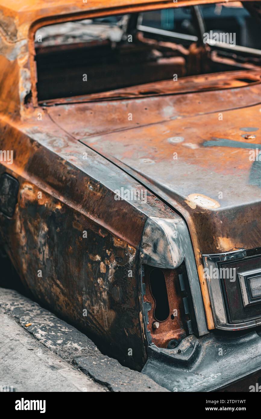 classic american car wreck, burned, rusty, historical city center ...