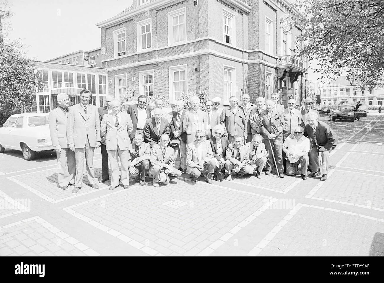 Mayor Van Stam and a group of people in front of the old town hall in ...