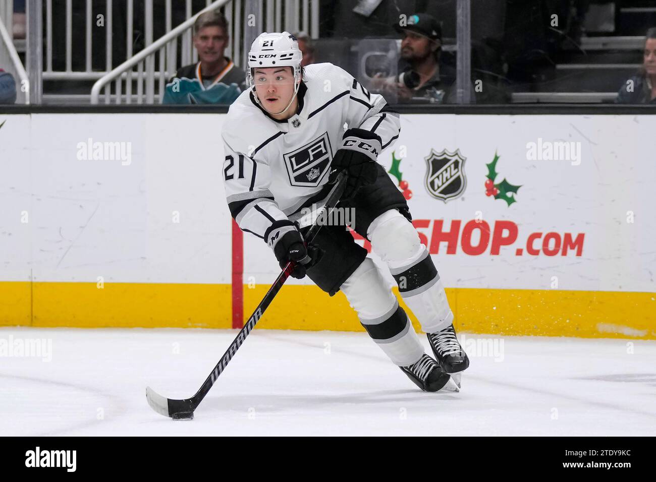 Los Angeles Kings defenseman Jordan Spence (21) skates with the puck ...