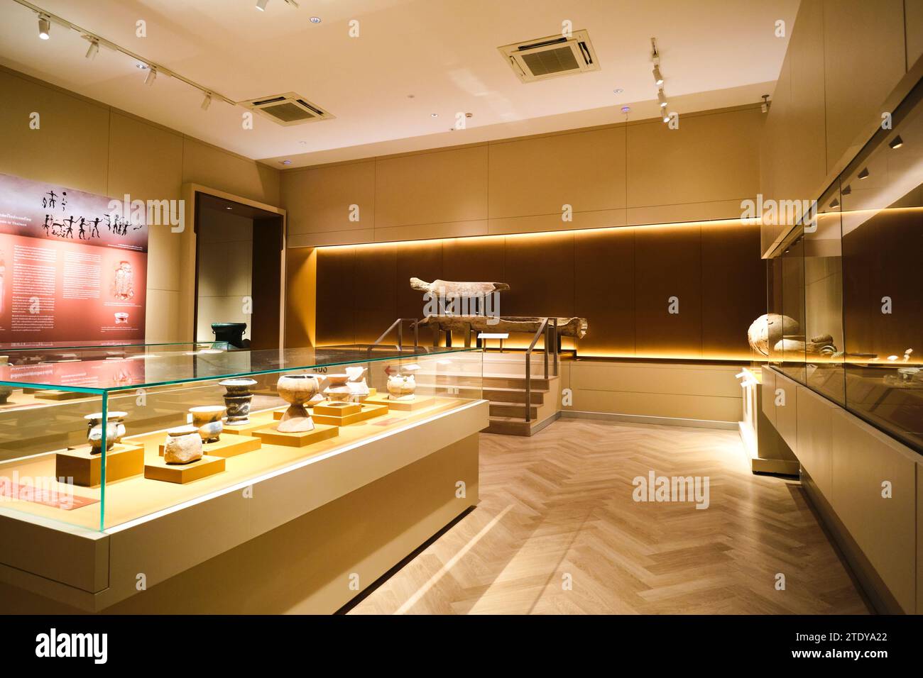 A gallery displaying ancient archeological artifacts and pottery, vases ...