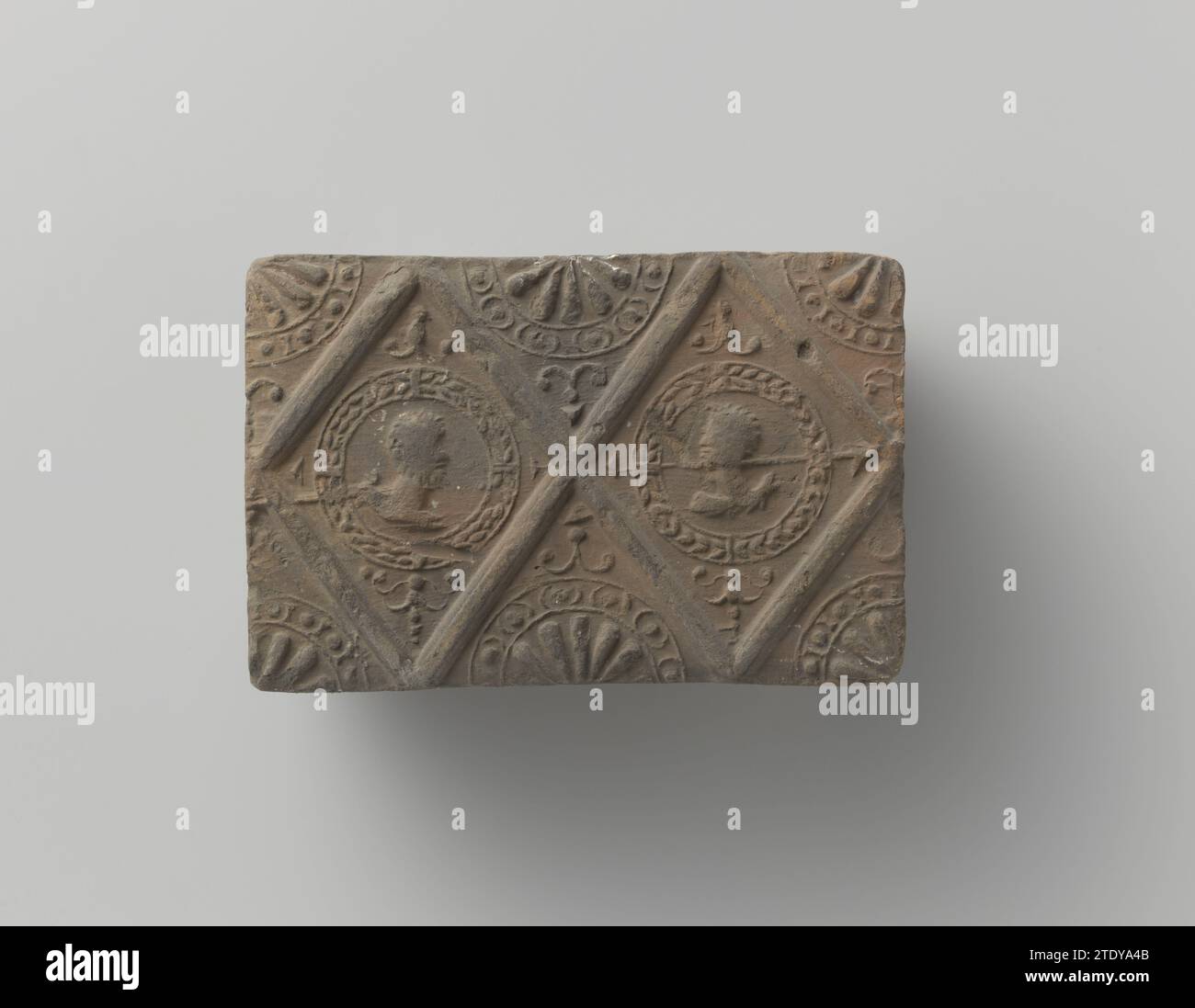 Hearing stone with a representation of a men's and women's head in two ...