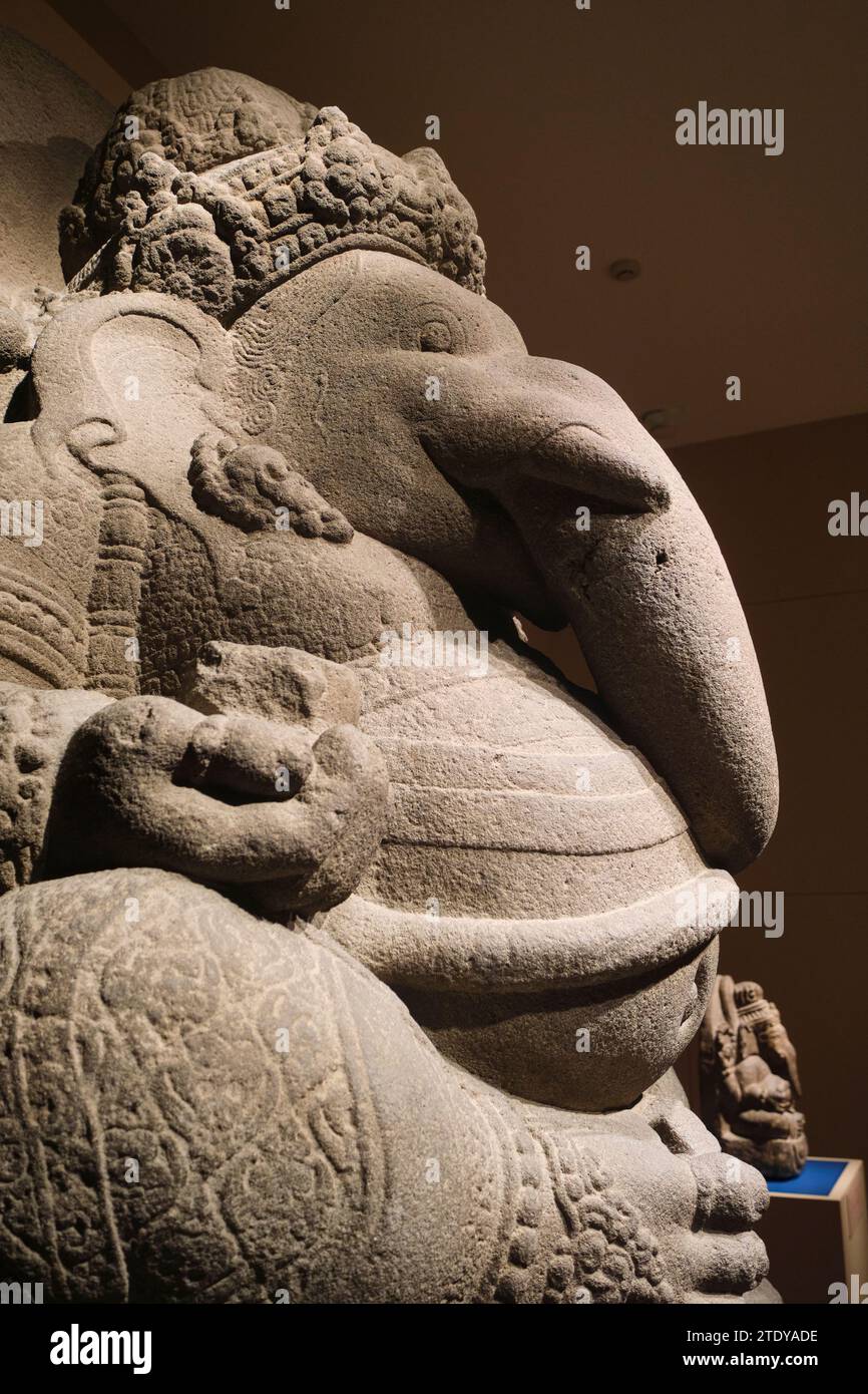 Profile of a beautiful, large, fat, cheery, fun stone carved sitting ...