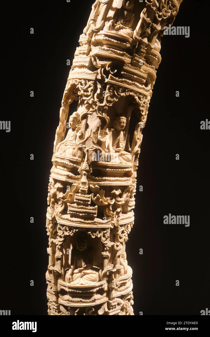 A detail in a display of an intricately carved ivory elephant tusk ...