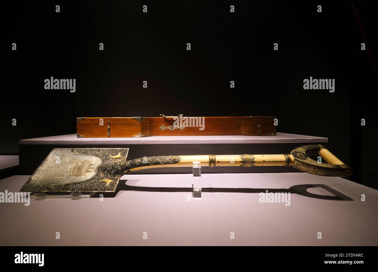 A display of a cerimonial, richly carved ivory, bone shovel, marking ...