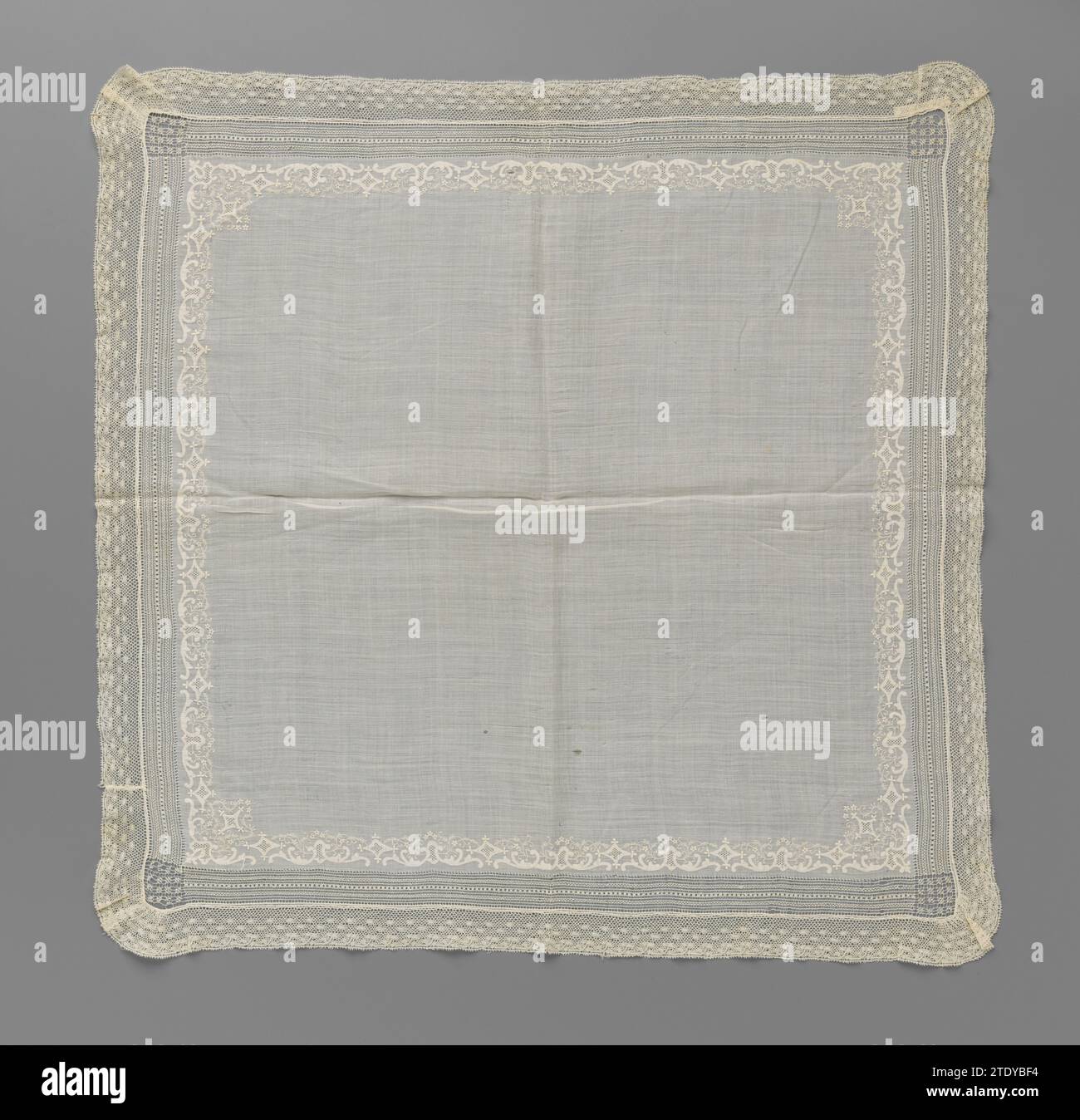 Batist handkerchief with a decorative band with C-volutes and diamond ...