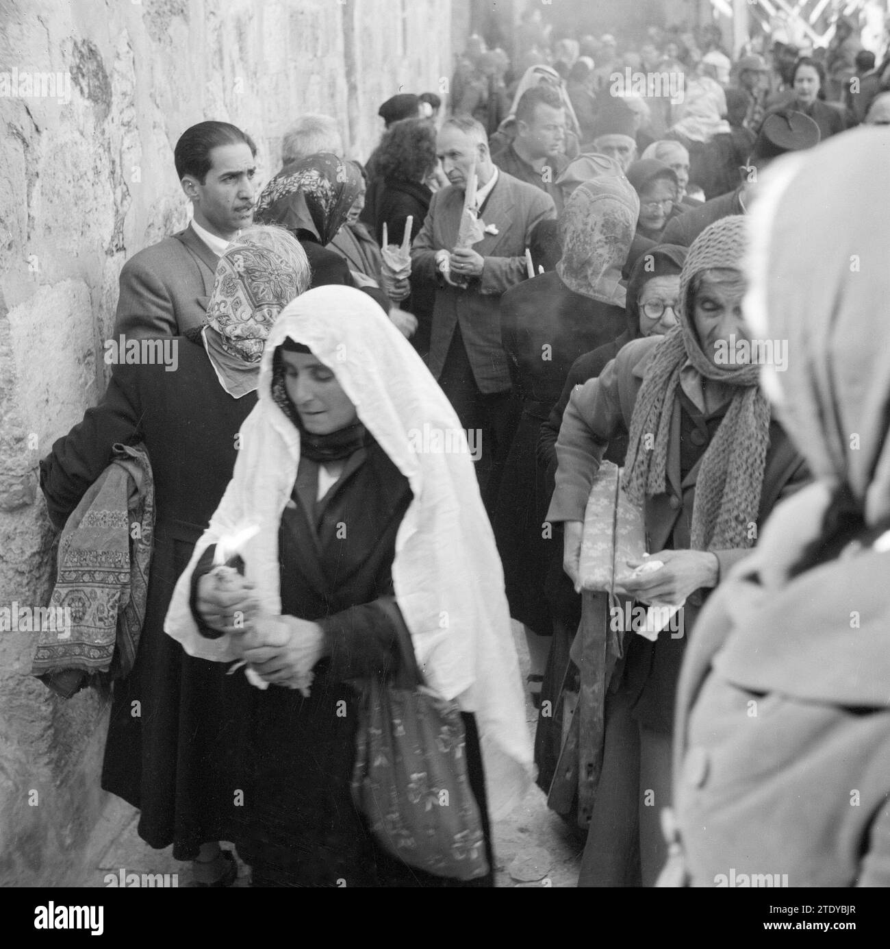 Easter celebration. Female worshipers with their candles in hand as ...