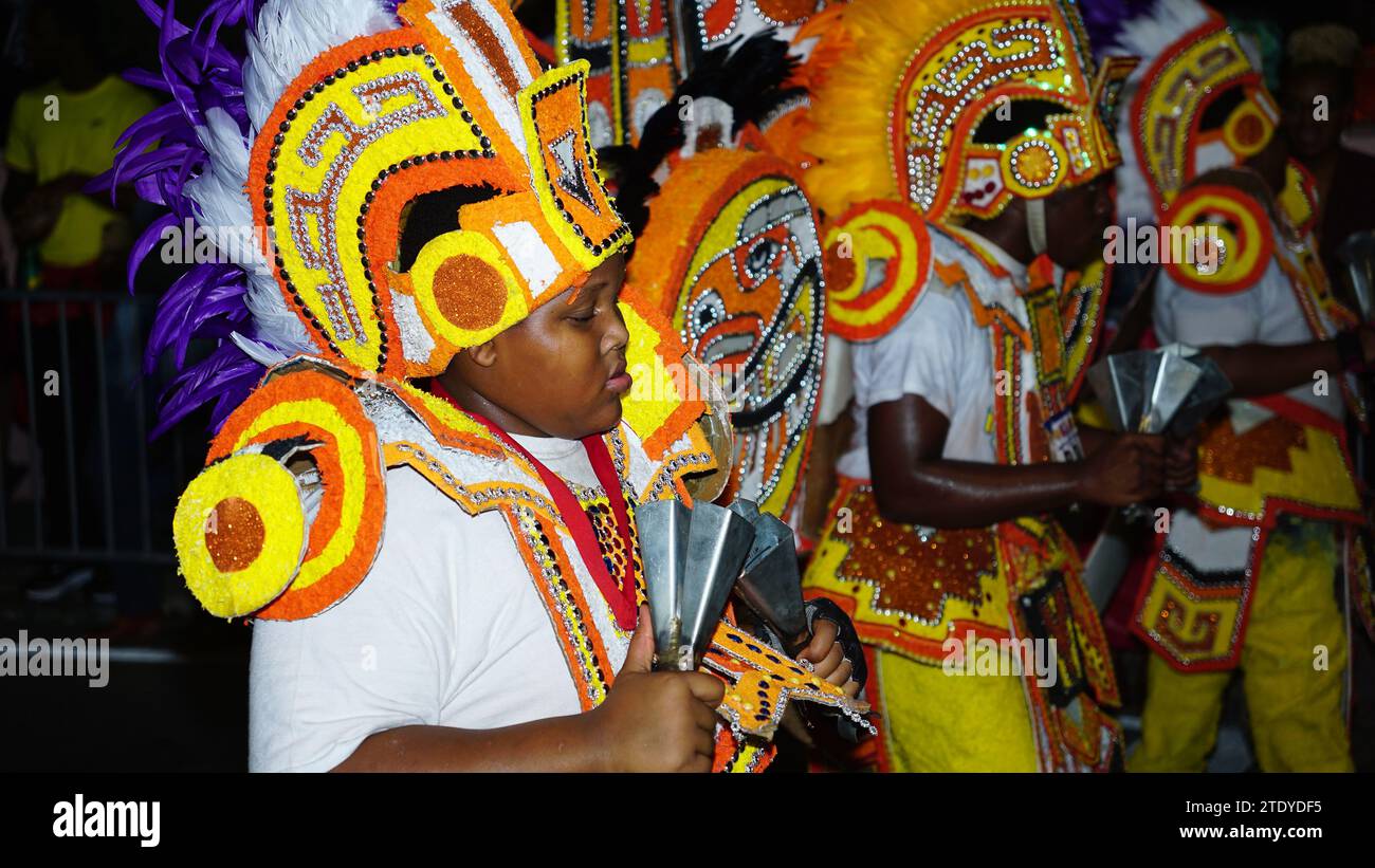 People celebrating in colorful costumes and dancing to music at the ...