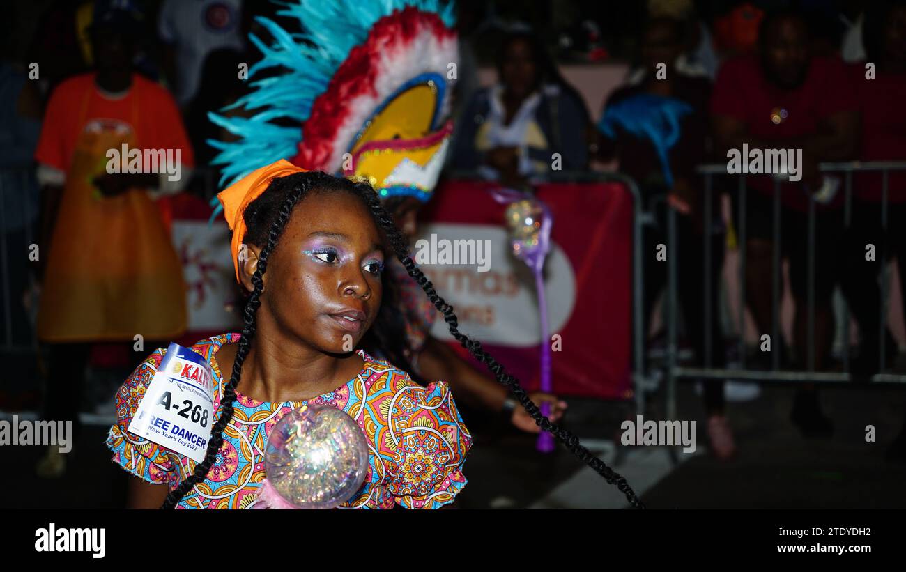 People celebrating in colorful costumes and dancing to music at the ...