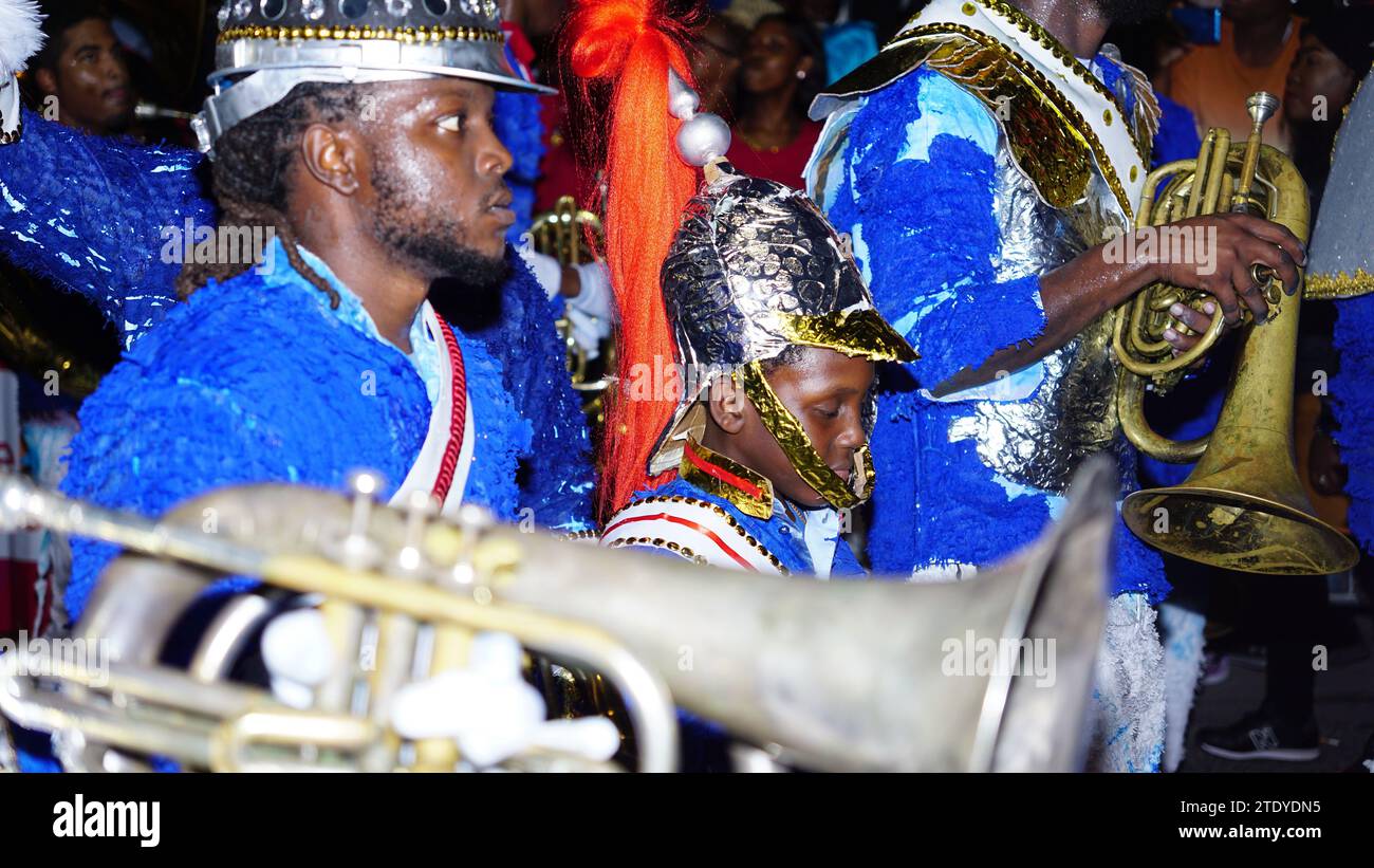 People celebrating in colorful costumes and dancing to music at the ...