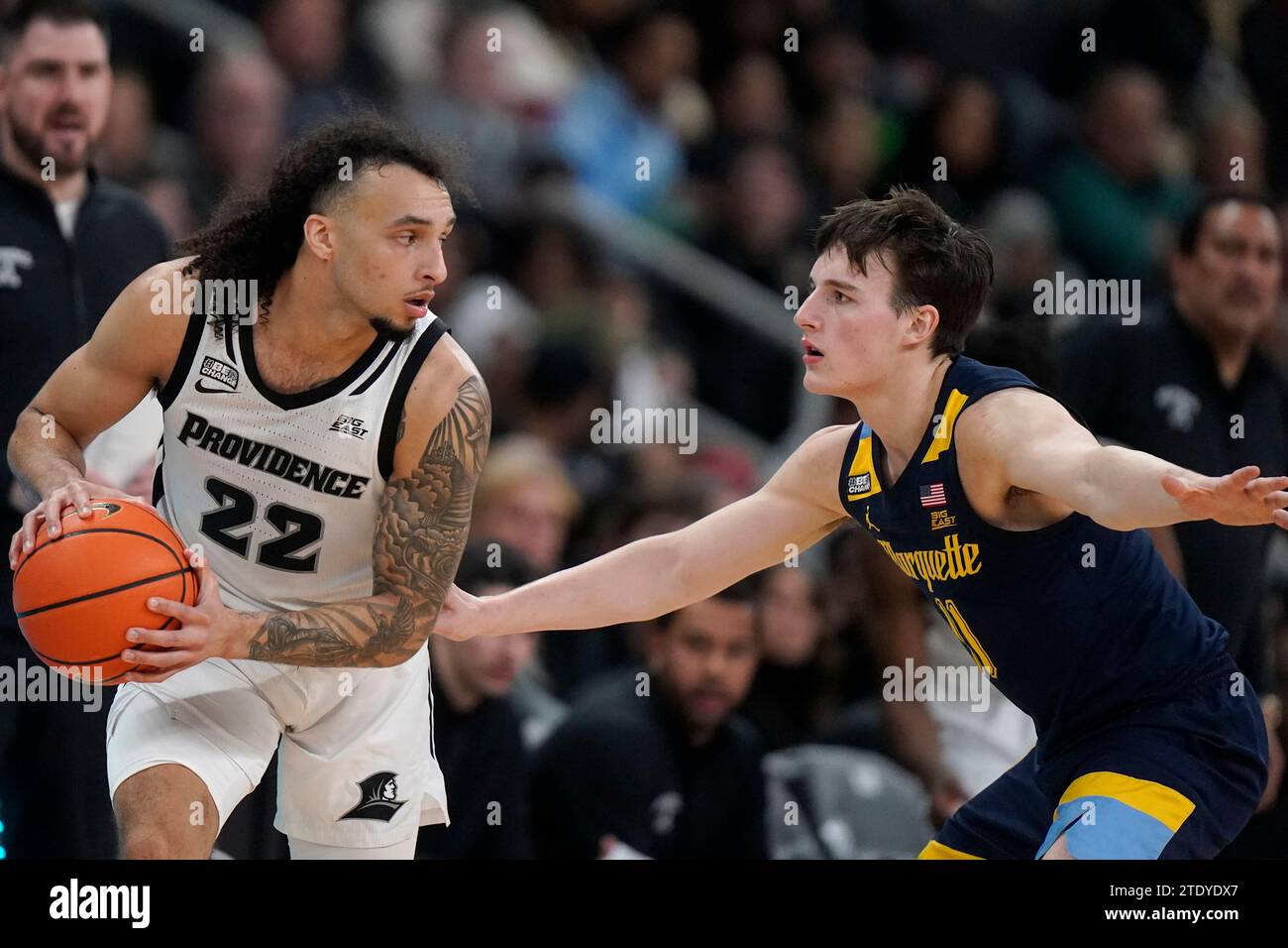 Providence guard Devin Carter (22) looks for an opening around ...