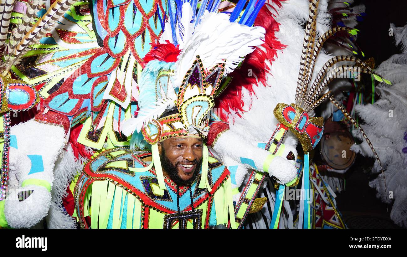 People celebrating in colorful costumes and dancing to music at the ...