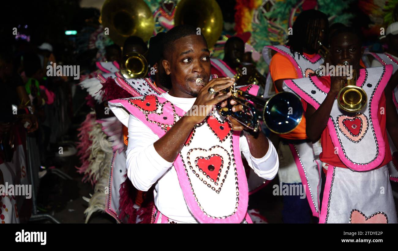 People celebrating in colorful costumes and dancing to music at the ...
