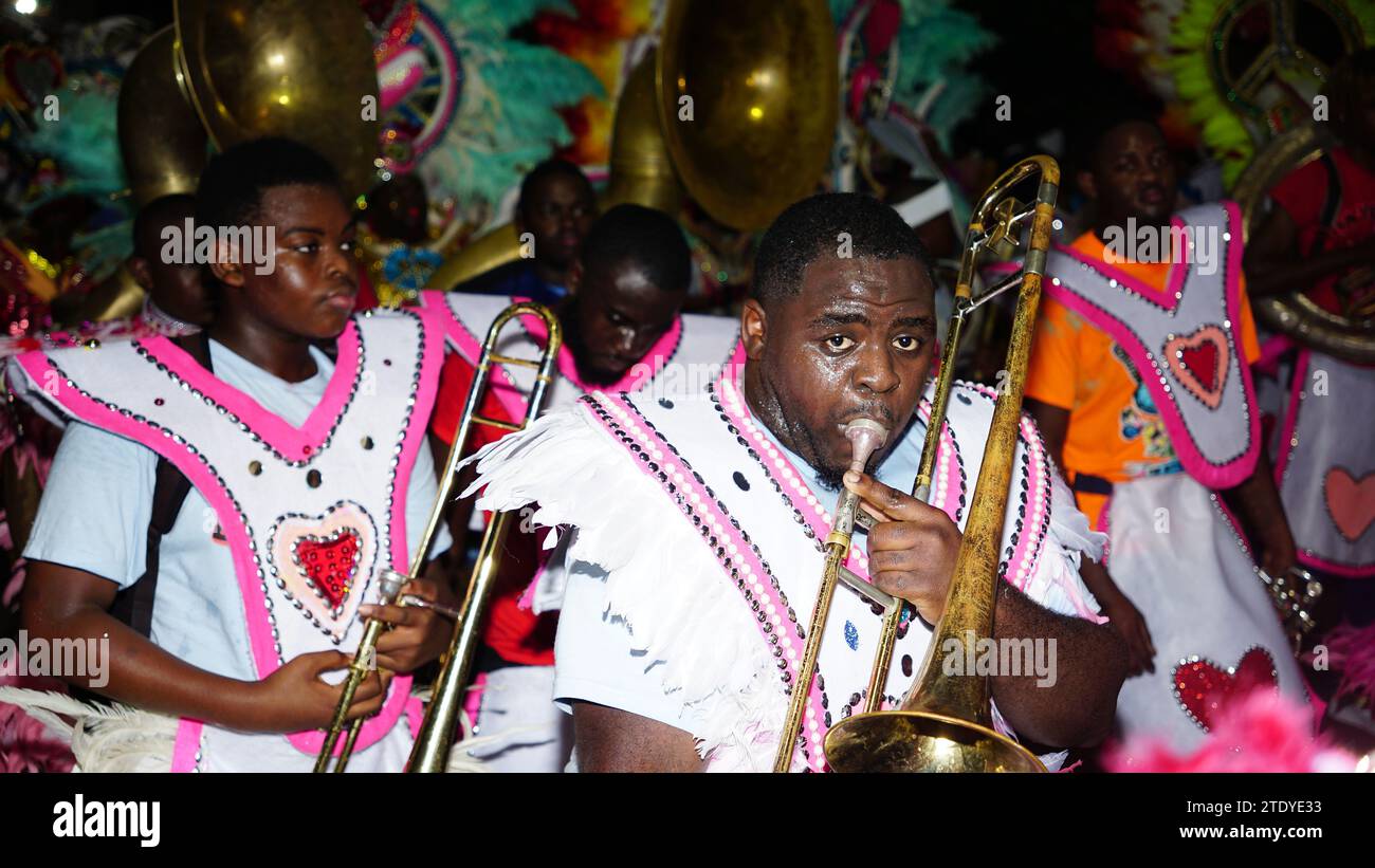 People celebrating in colorful costumes and dancing to music at the ...