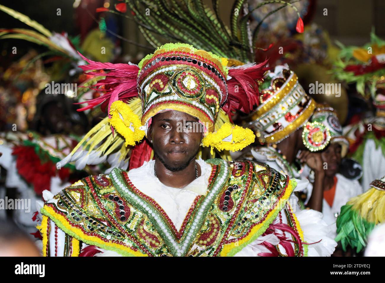 People celebrating in colorful costumes and dancing to music at the ...
