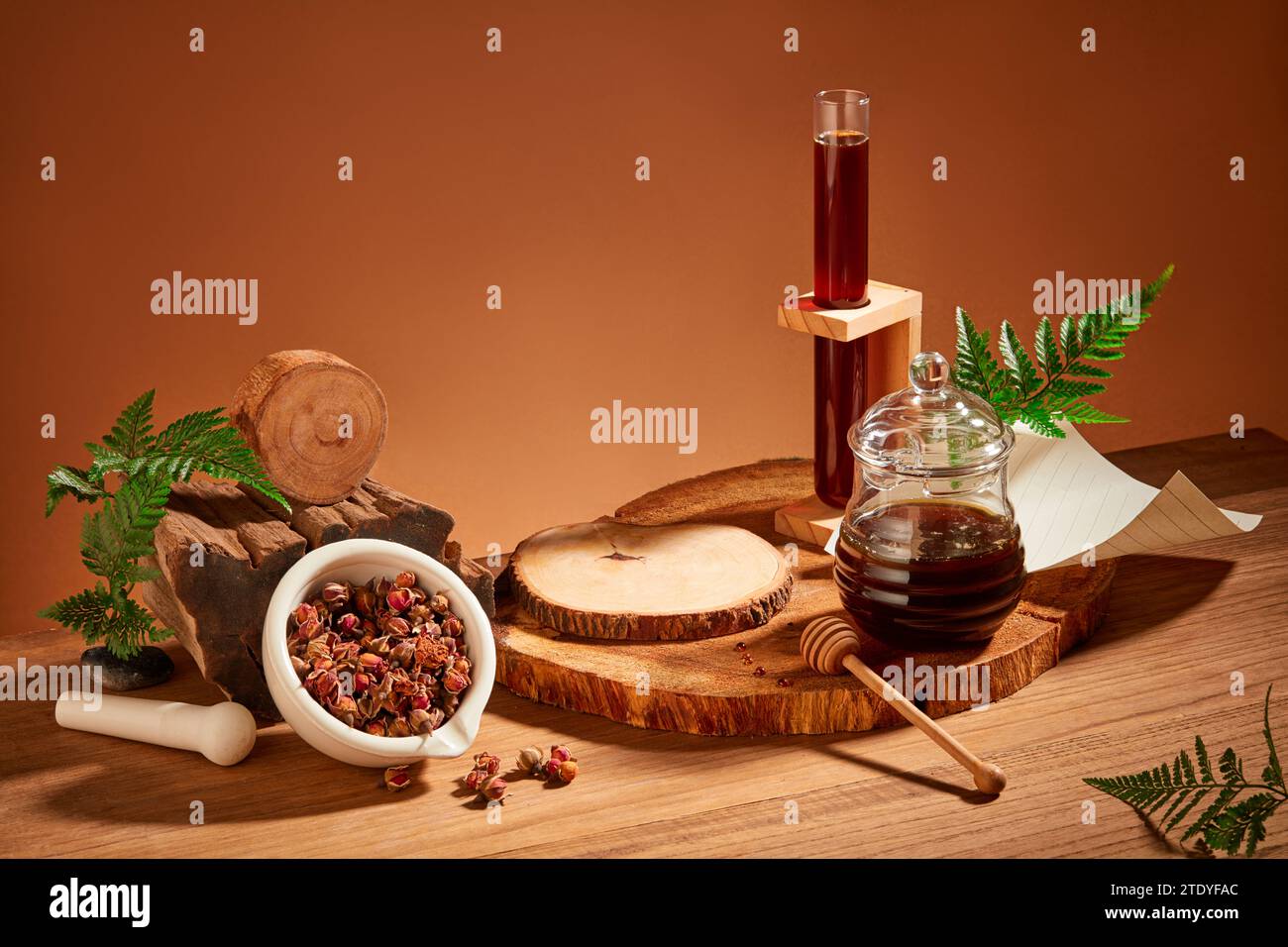 Honey is stored in glassware, dried rose buds in a mini ceramic mortar ...