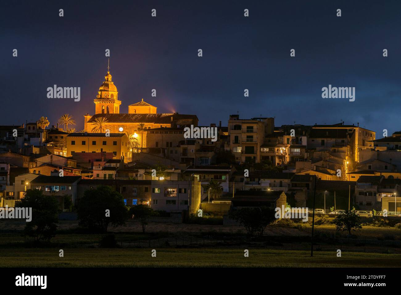 Church of Sant Bartomeu in Montuïri, illuminated at blue hour and at ...