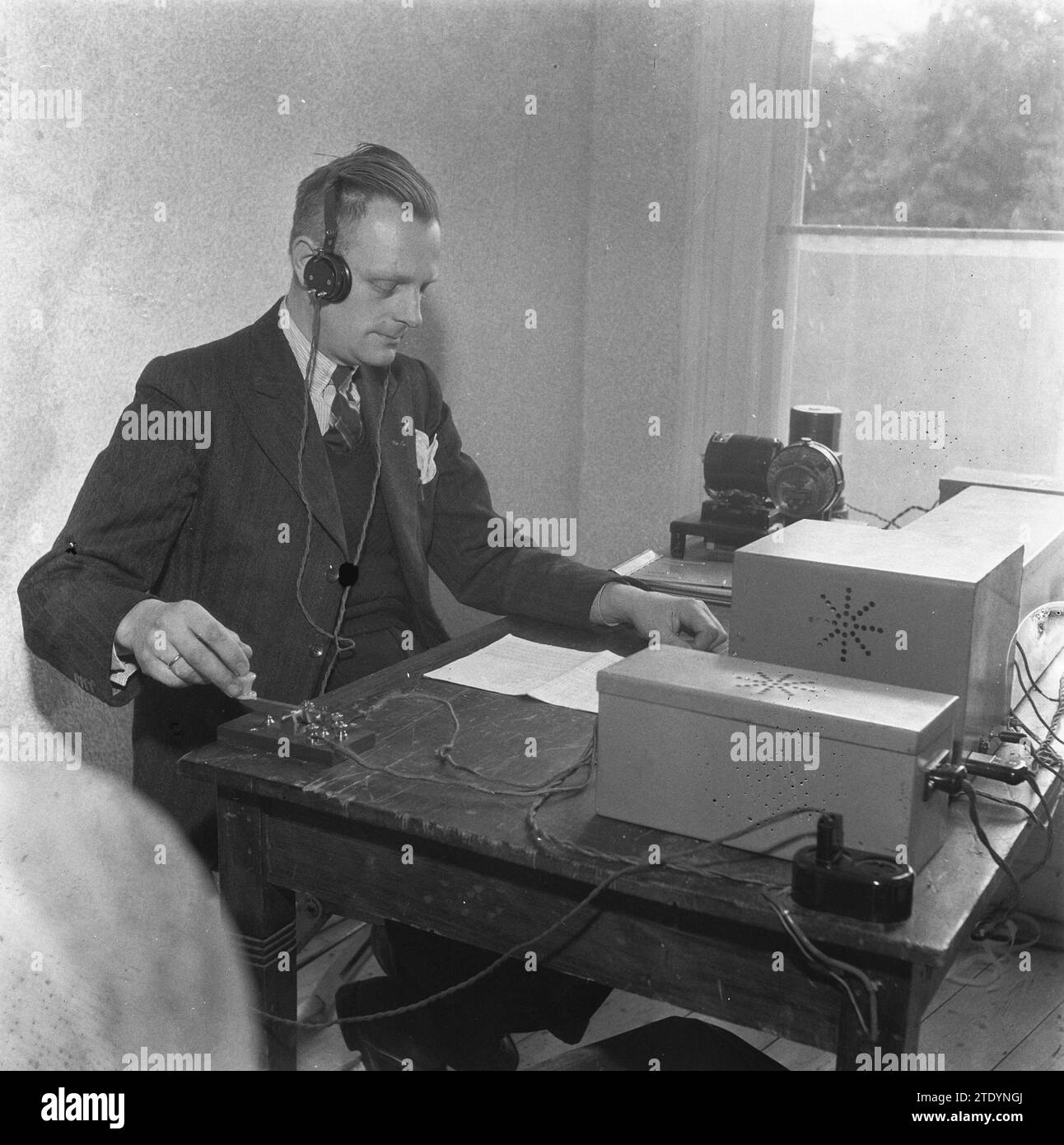 Men training on telegraph keys for World War II telegraph operator work ...