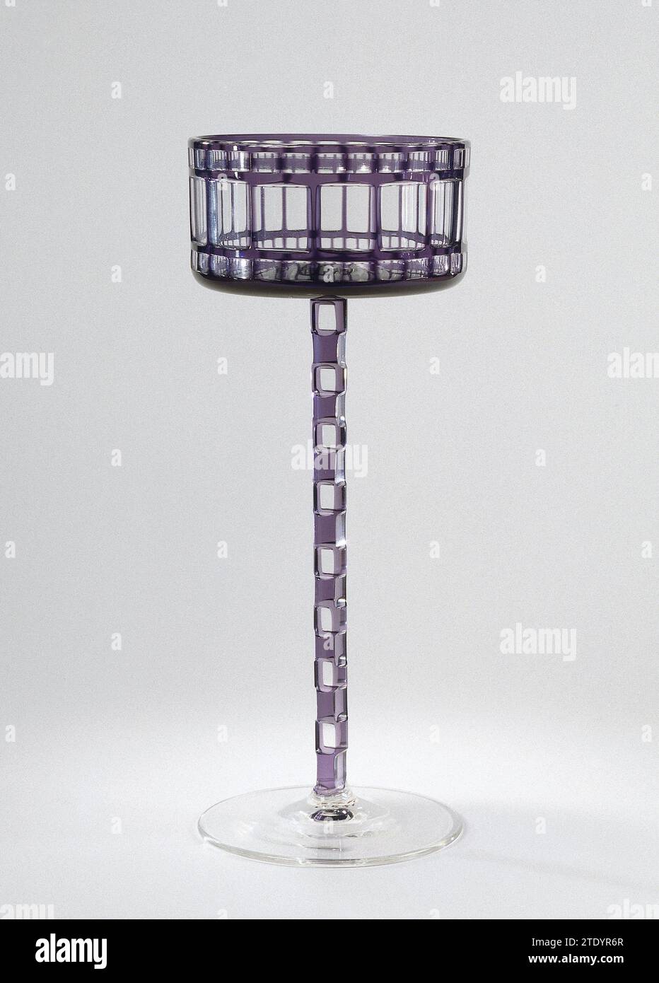 Chalice glass with a purple überfang with dripping squares and ...