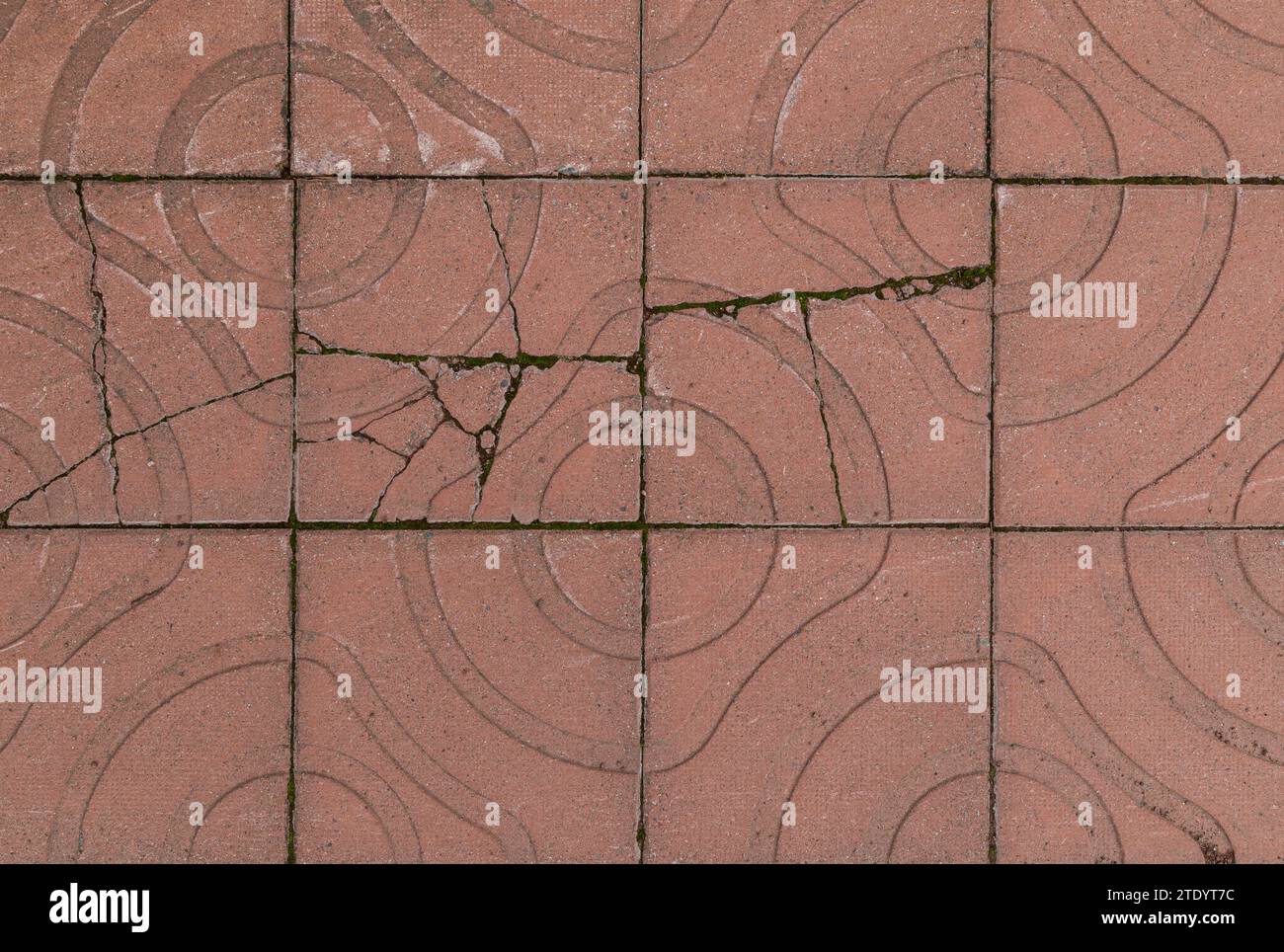 Broken&weathered red square paving stones or blocks with geometric ...